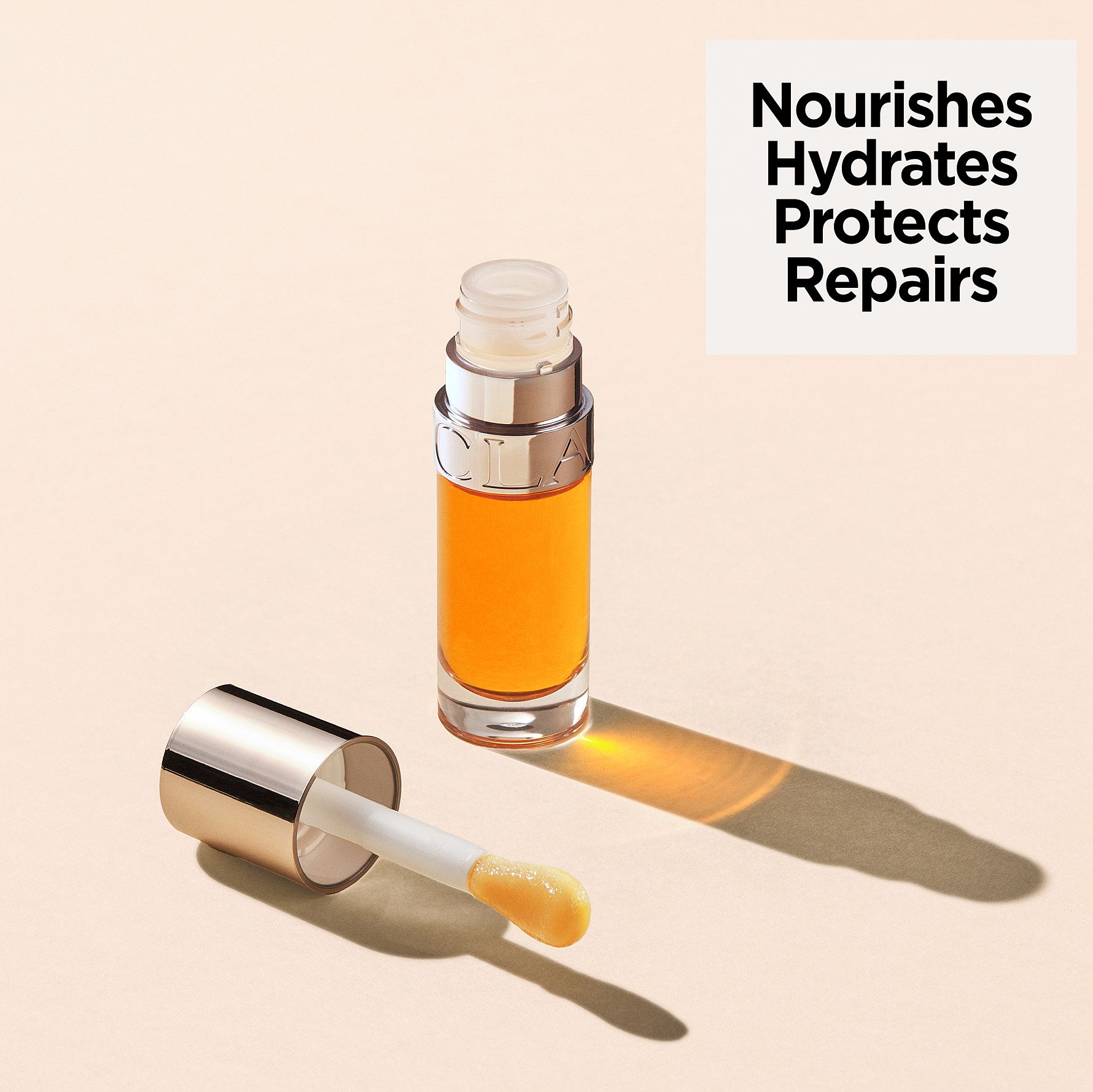 Køb Instant Comfort Lip Oil 01 Honey fra Clarins - Matas